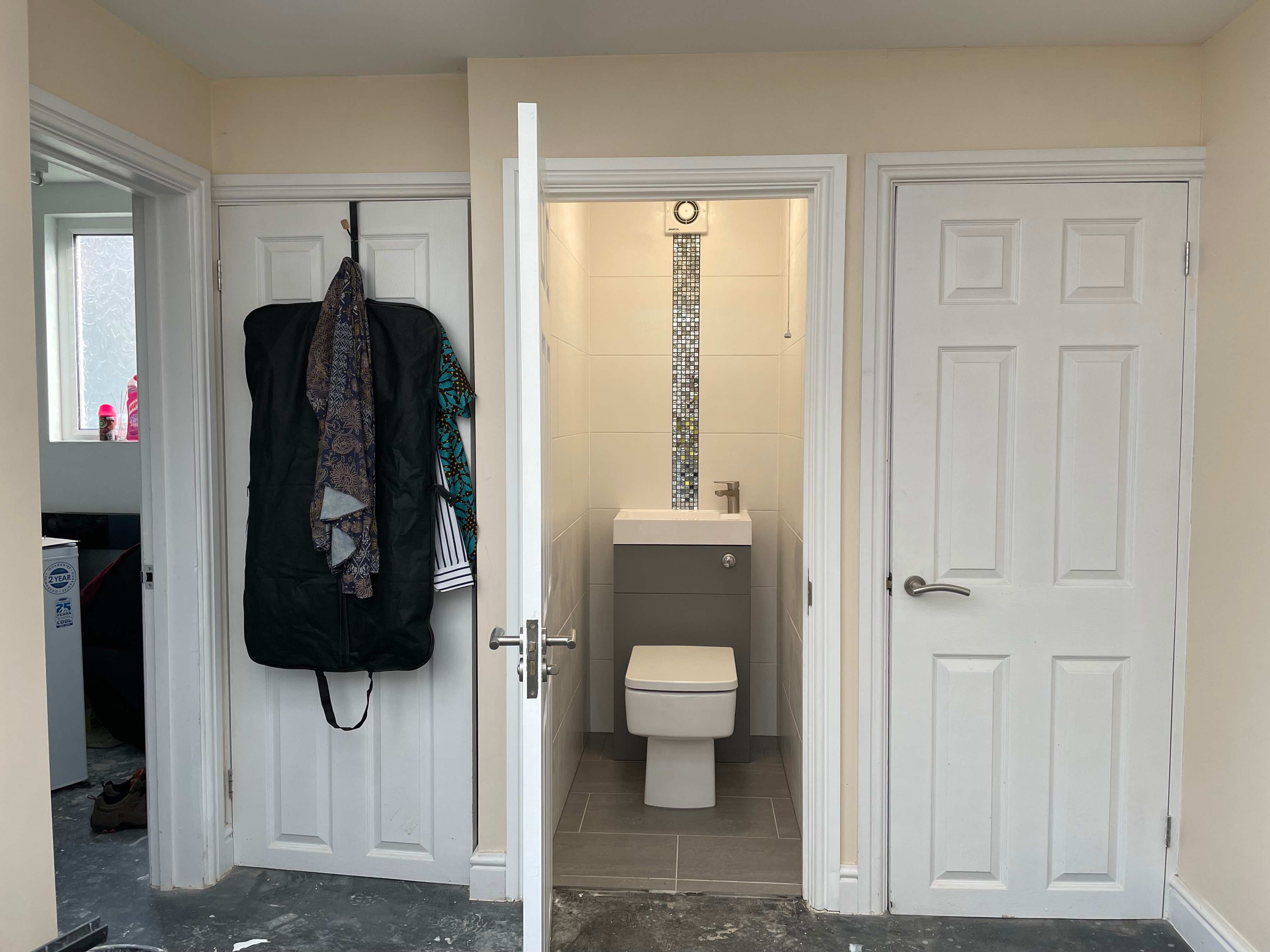 Cloakroom suit with combination toilet and sink installation at Swanley